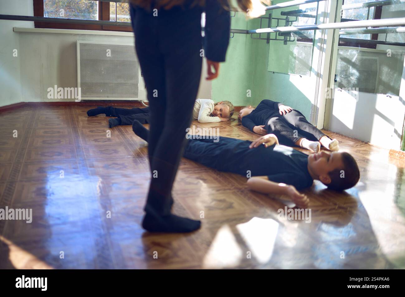 group of pre-teens perform a teacher's task during an acting class ...