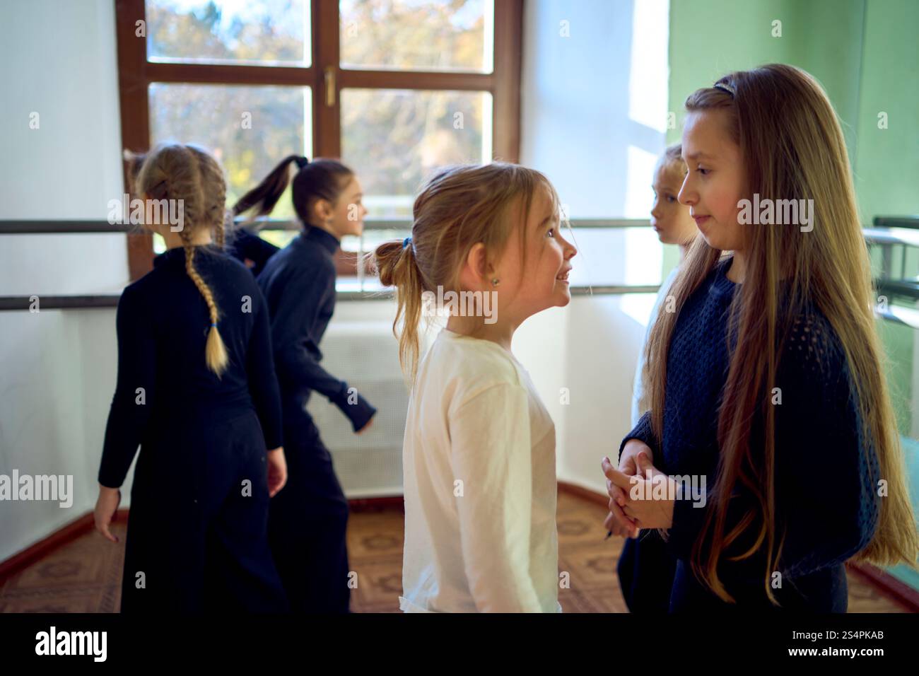 group of pre-teens perform a teacher's task during an acting class ...