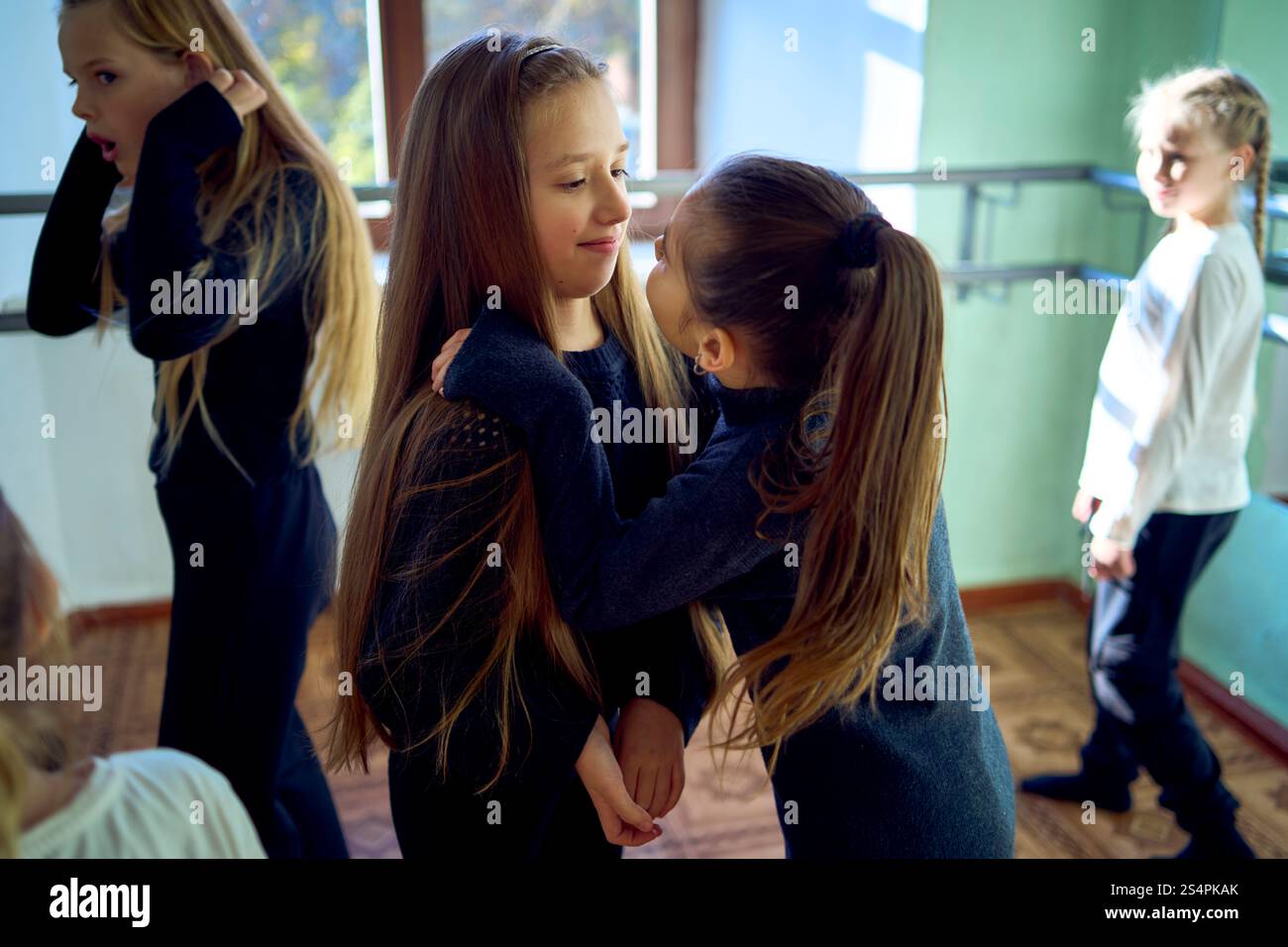 group of pre-teens perform a teacher's task during an acting class ...