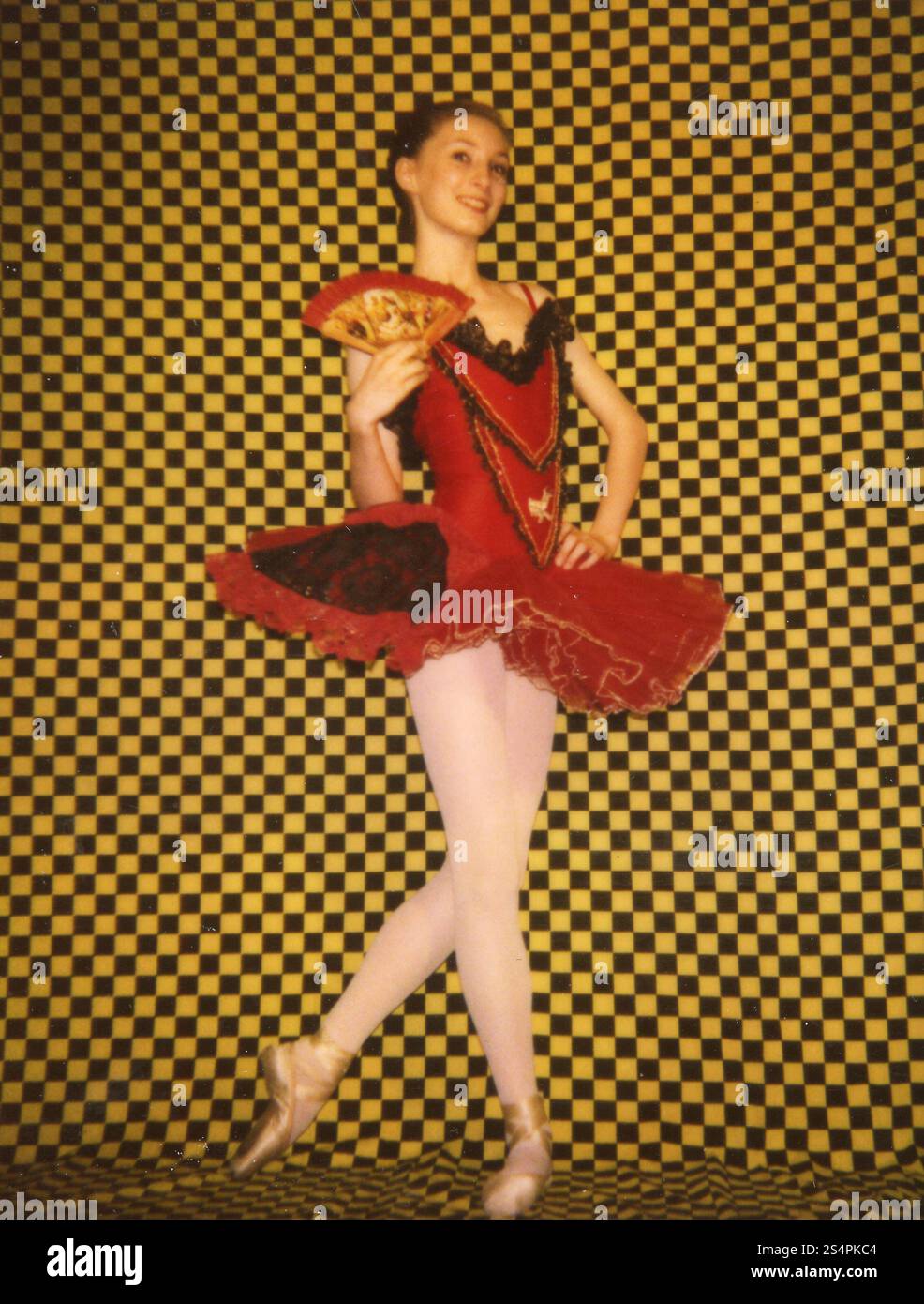 Girl in red ballet outfit performing a position, Italy 1980s Stock ...