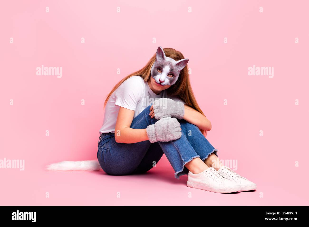 Creative portrayal of a young girl in a cat-inspired costume on a ...