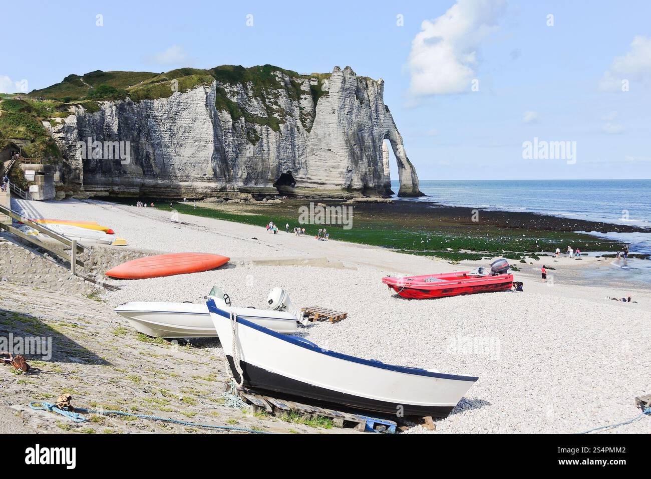 boats on resort english channel beach and view of cliff in Etretat town ...
