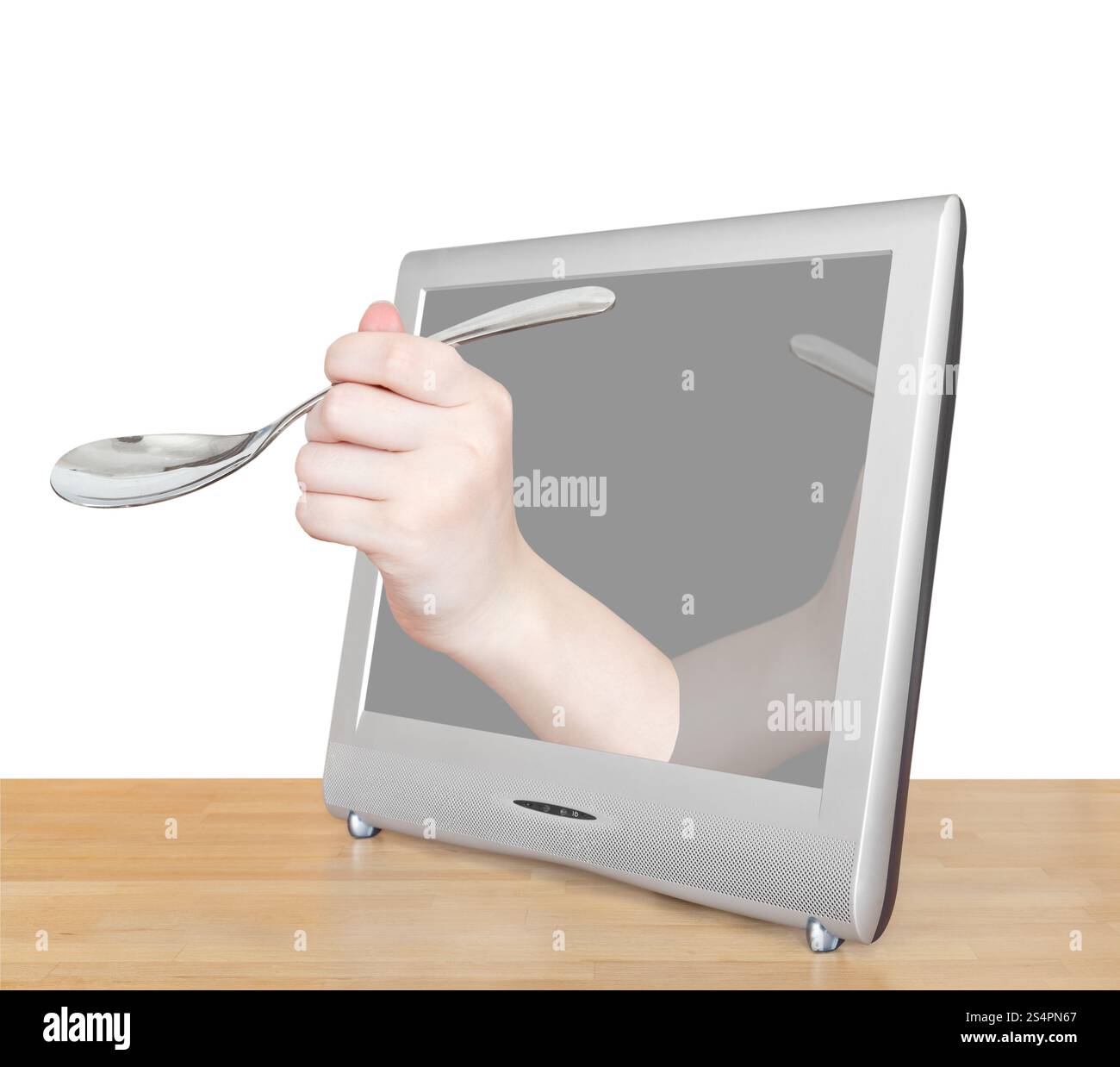 hand with soup spoon leans out TV screen isolated on white background ...