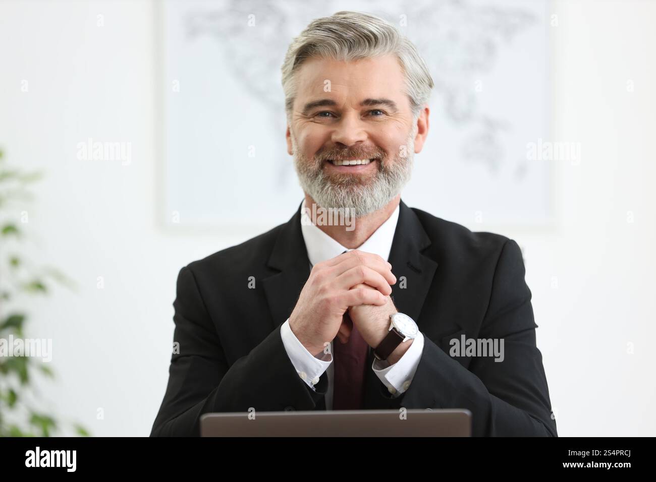 Portrait of banker in jacket at workplace Stock Photo - Alamy