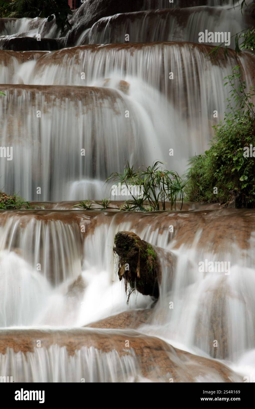 a waterfall in the Tropical Forest near the Village of Fang north of ...