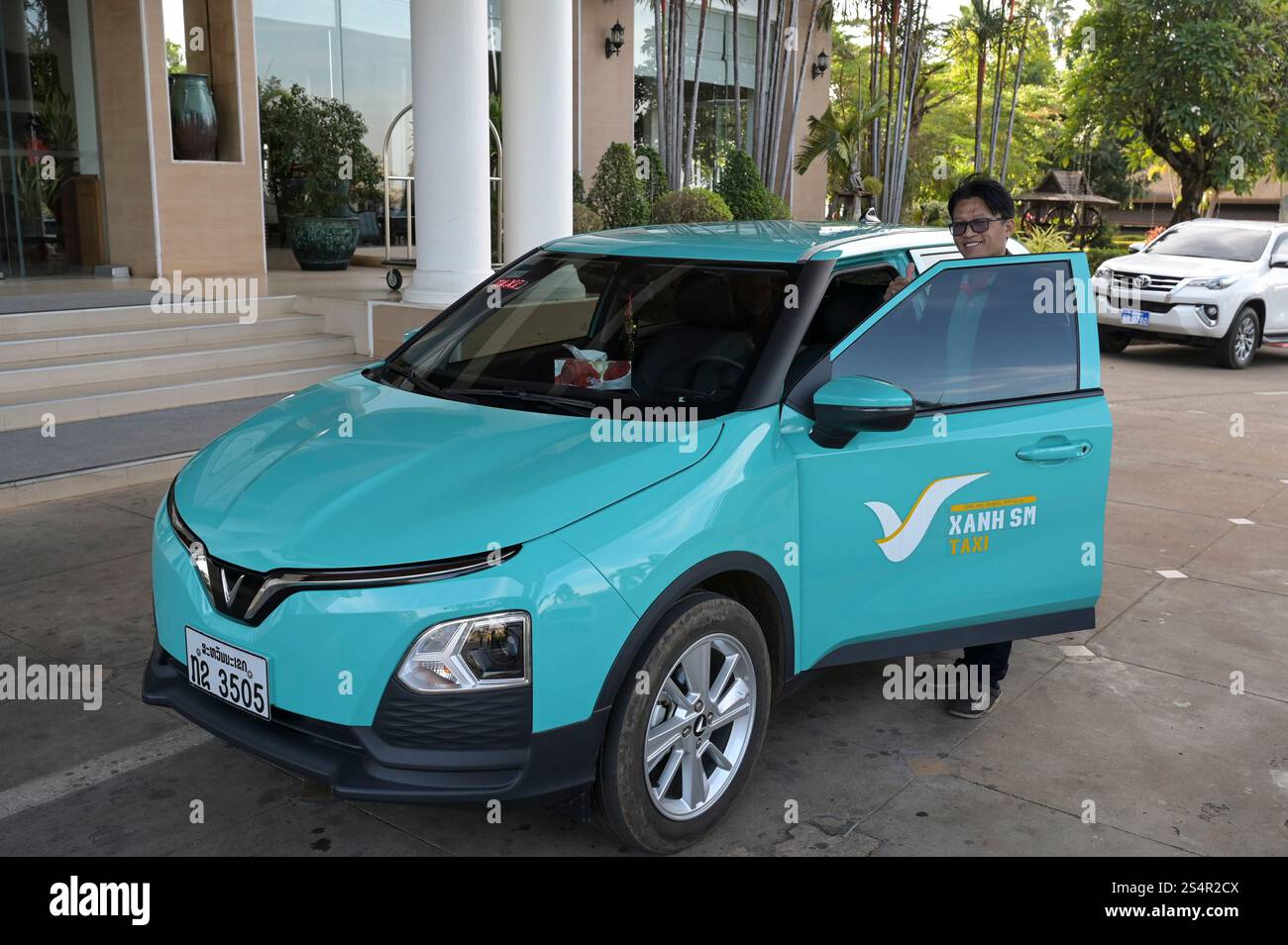 LAO P.D.R., Pakse, vietnamese Vinfast electric car of APP Taxi company ...