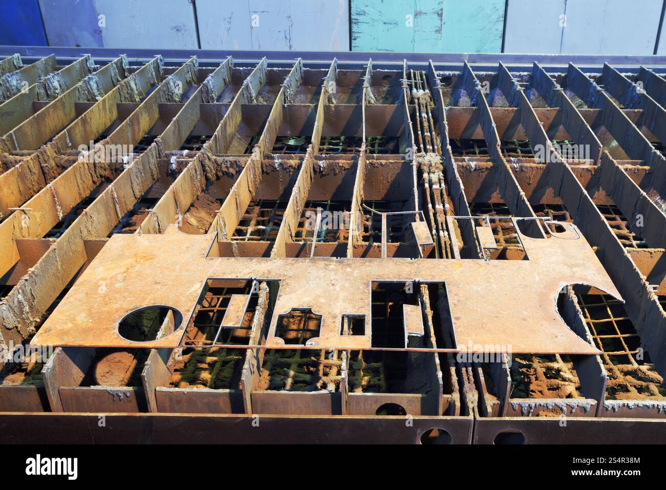 sheet steel with cutouts on guide way of cutting machine in mechanical ...