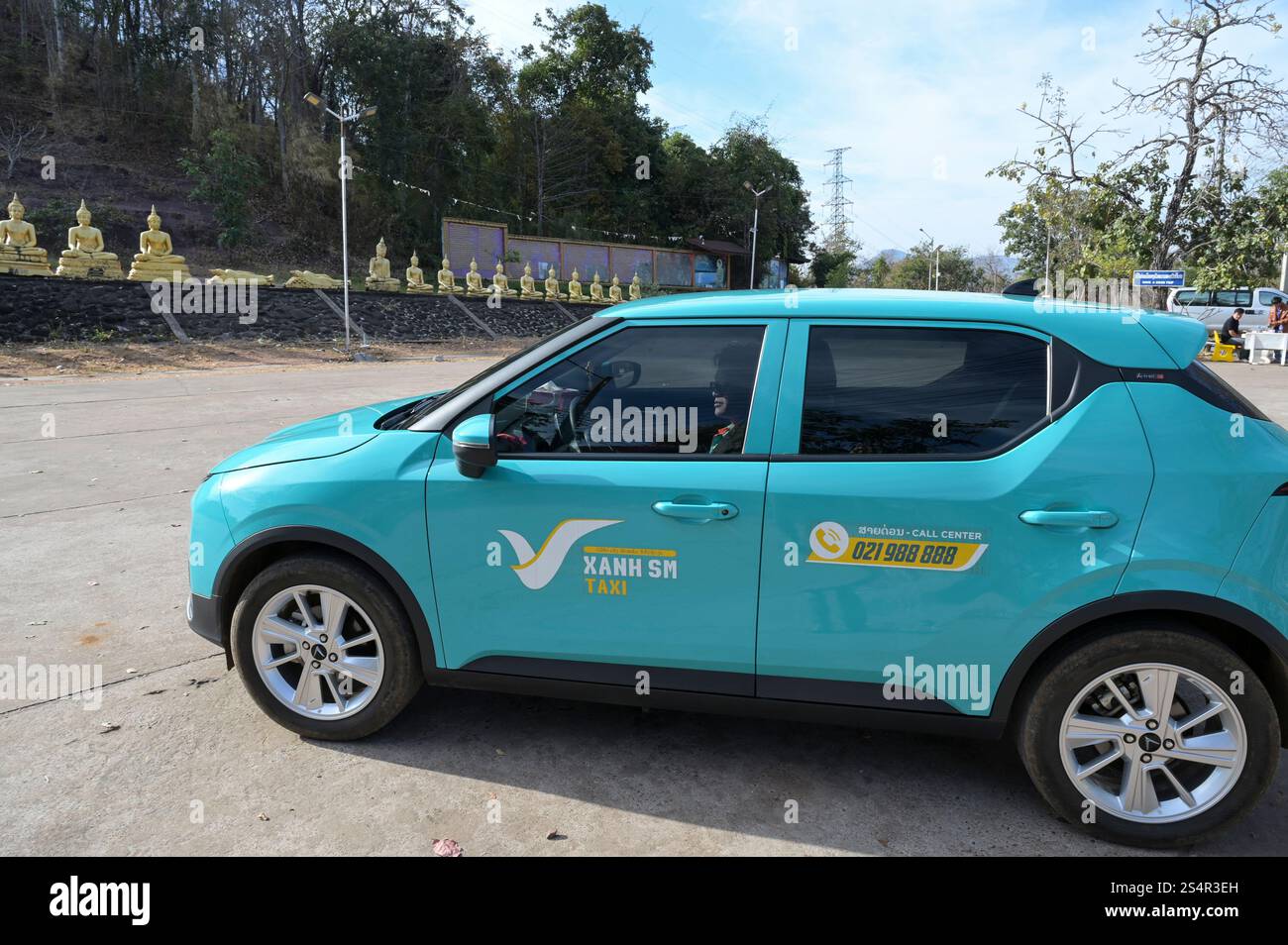 LAO P.D.R., Pakse, Golden Buddha at Wat Phou Salou, vietnamese Vinfast ...