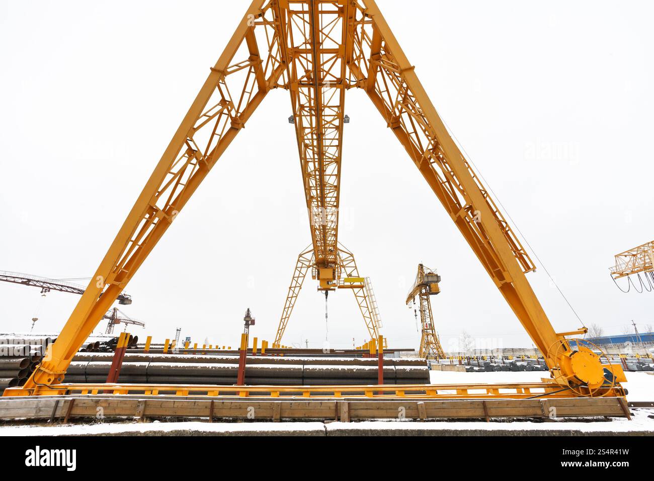 overhead crane over outdoor warehouse with metal products Stock Photo ...