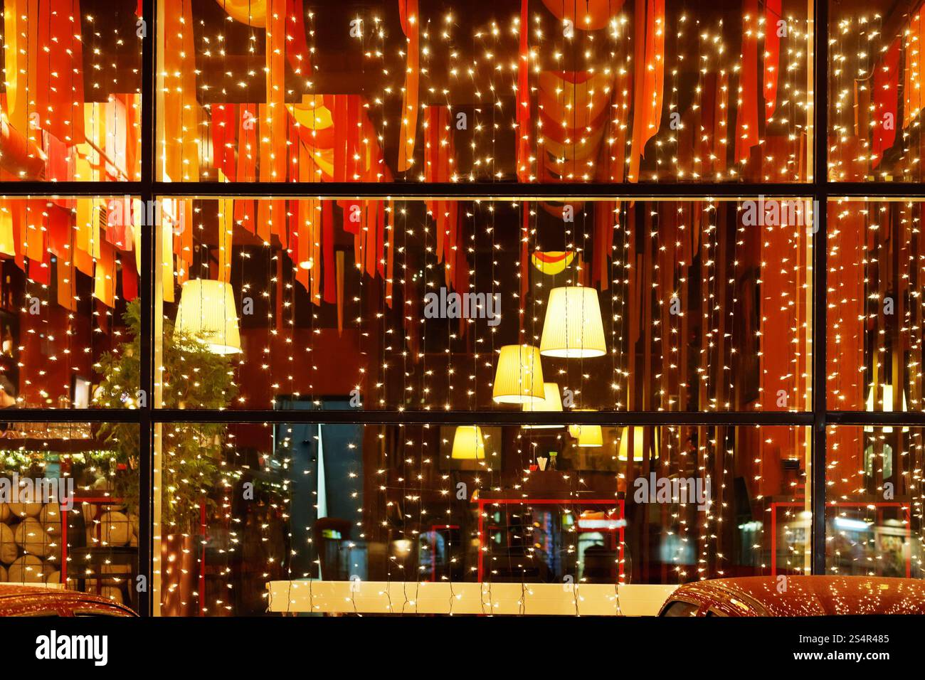 Christmas decorative lights of restaurant window in night Stock Photo ...