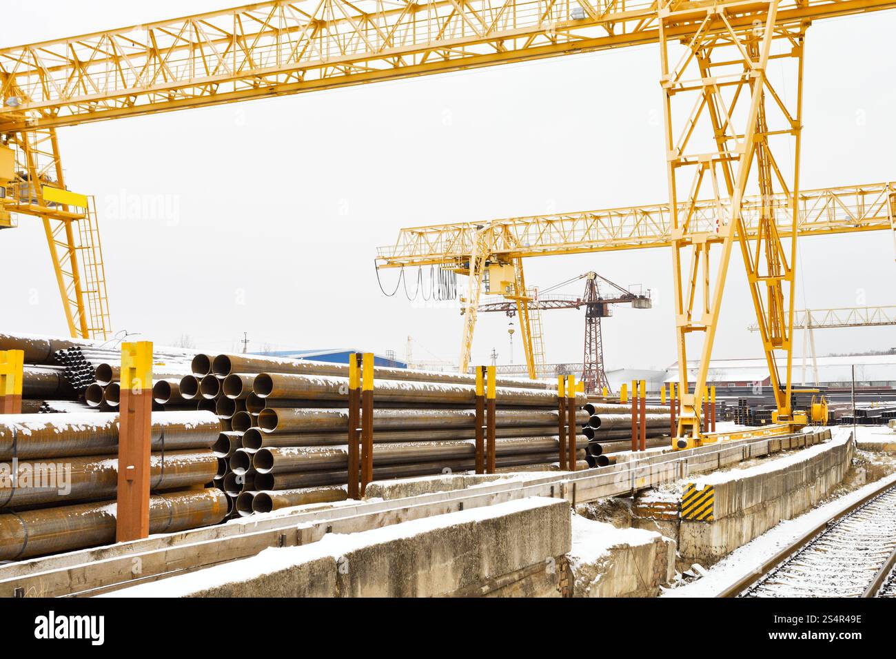 bridge cranes over railroad in metal pipe outdoor warehouse Stock Photo ...
