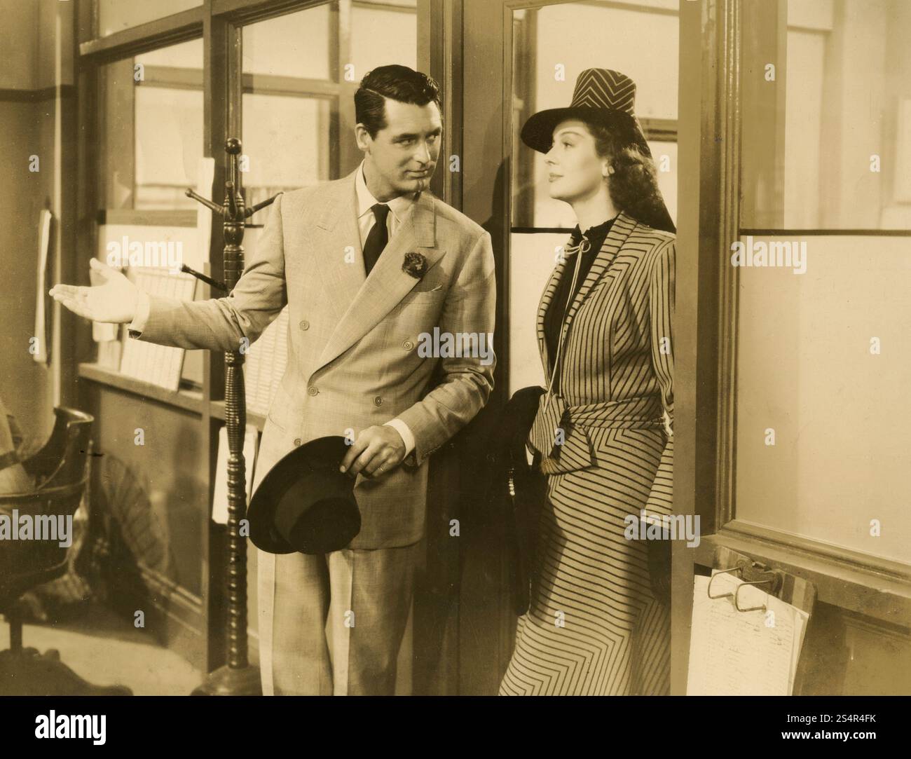 Actor Cary Grant and actress Rosalind Russel in the movie His Girl ...
