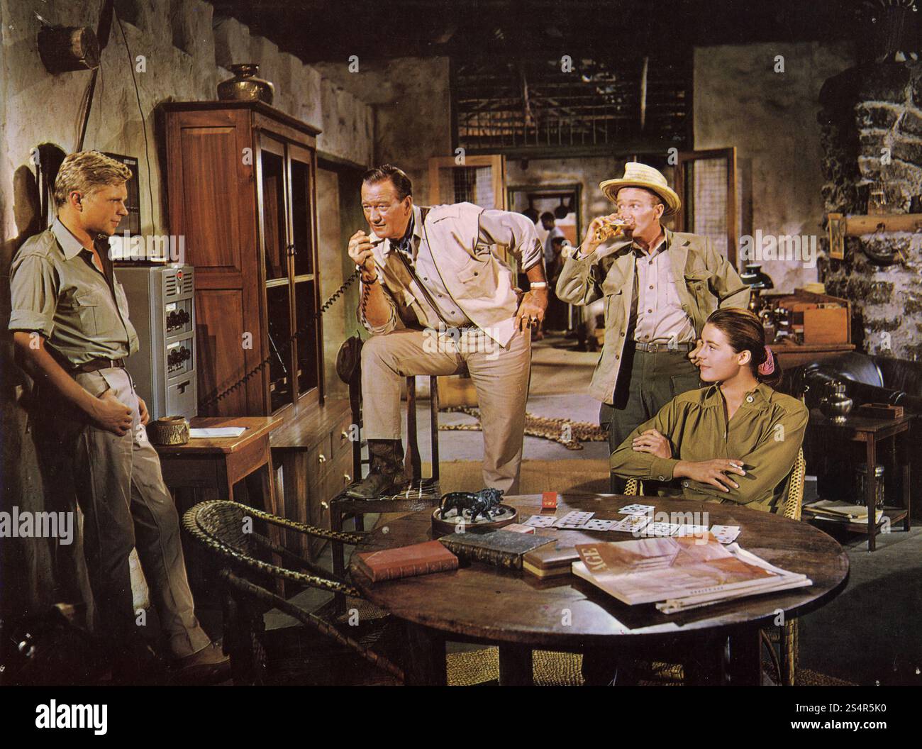 Actors Hardy Kruger, John Wayne, Red Buttons and Michele Girardon in ...