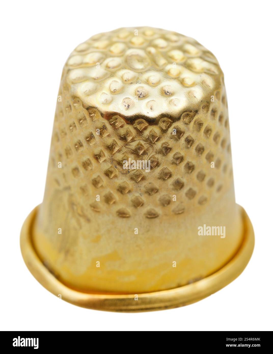 old sewing thimble isolated on white background Stock Photo - Alamy