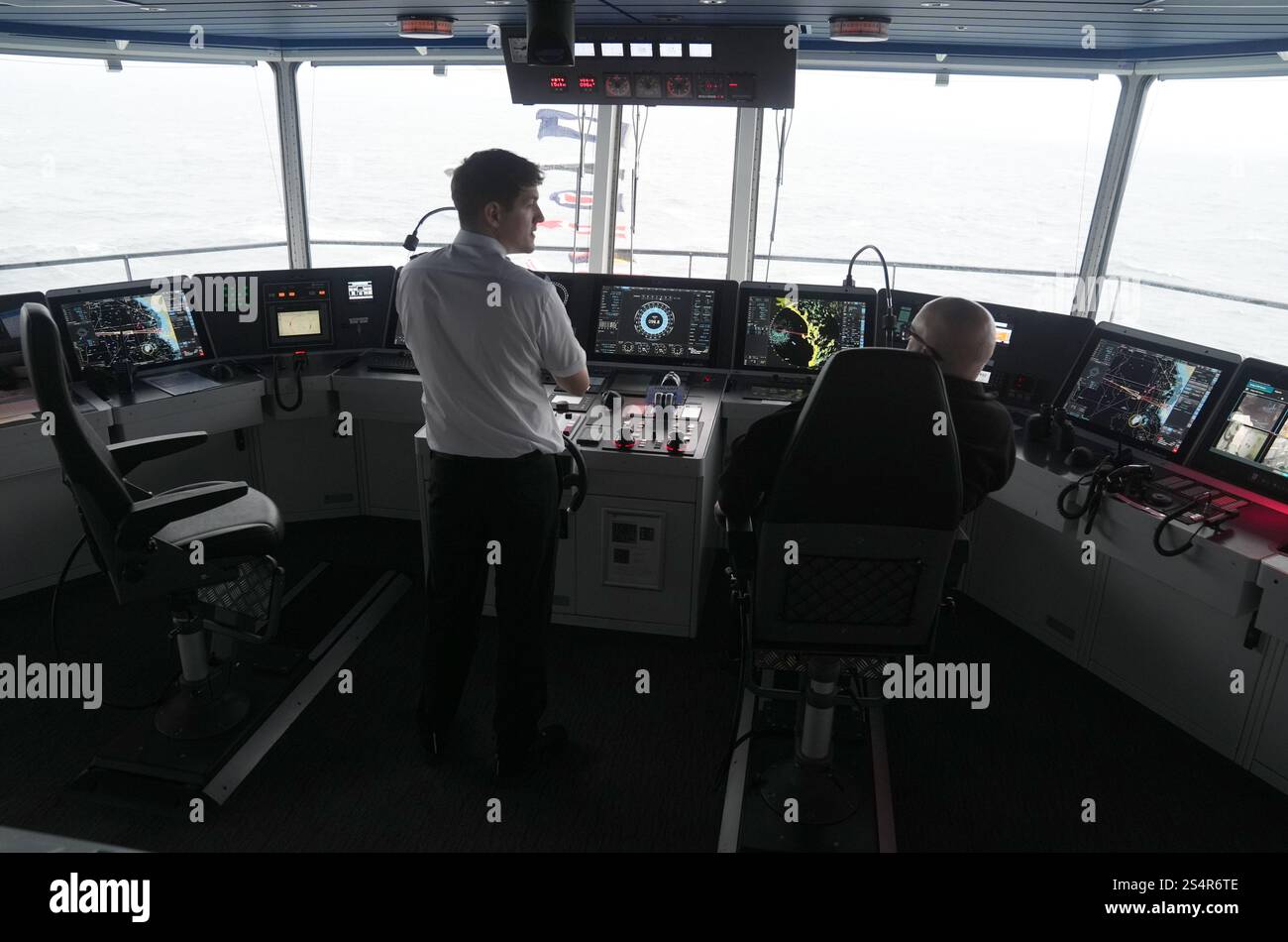 Staff on the bridge of The Glen Sannox ferry as it departs Brodick on ...