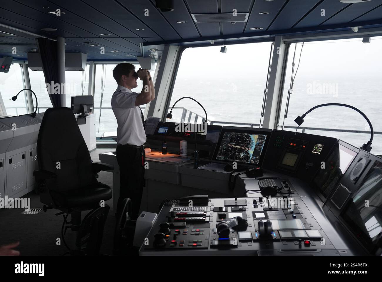 Staff on the bridge of The Glen Sannox ferry as it departs Brodick on ...