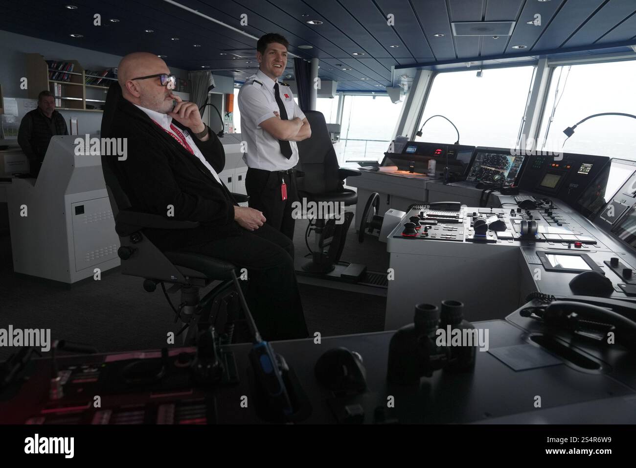 Staff on the bridge of The Glen Sannox ferry as it departs Brodick on ...