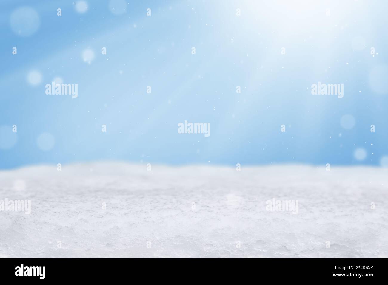 Christmas background with snowdrift, falling snow and sun rays with ...