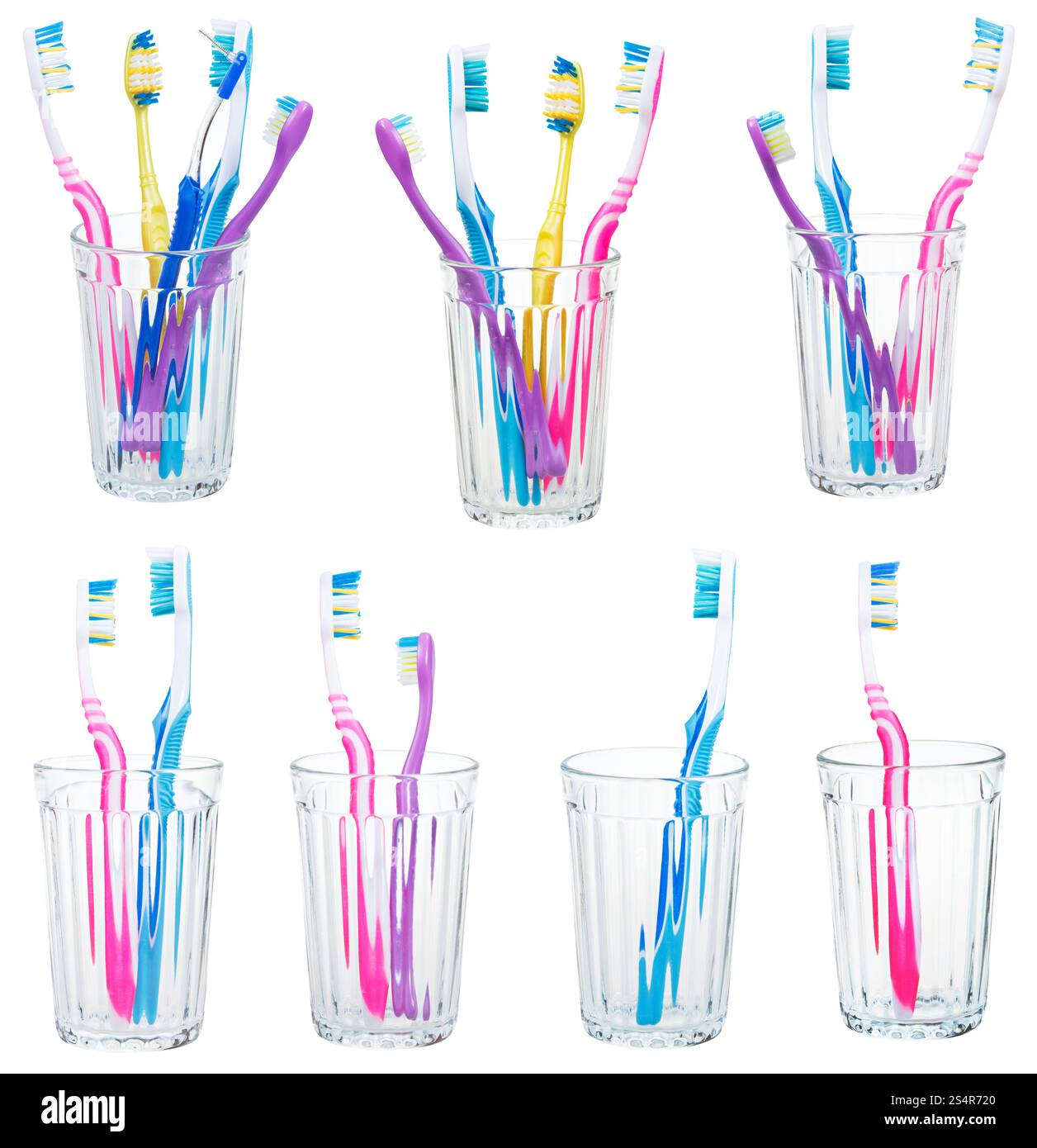 collection of tooth brushes in clear glases isolated on white ...