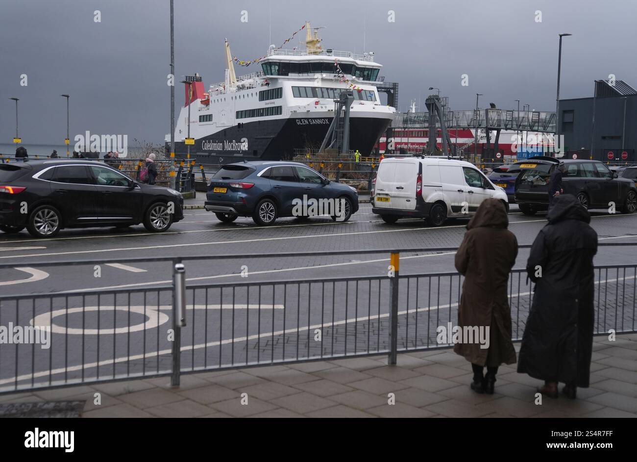 Cars wait to board The Glen Sannox ferry ahead of departing Brodick on ...