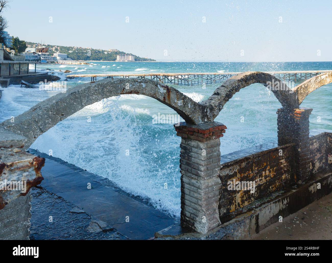 Sea storm, ruined pier and splashes of surf in front (Black Sea ...
