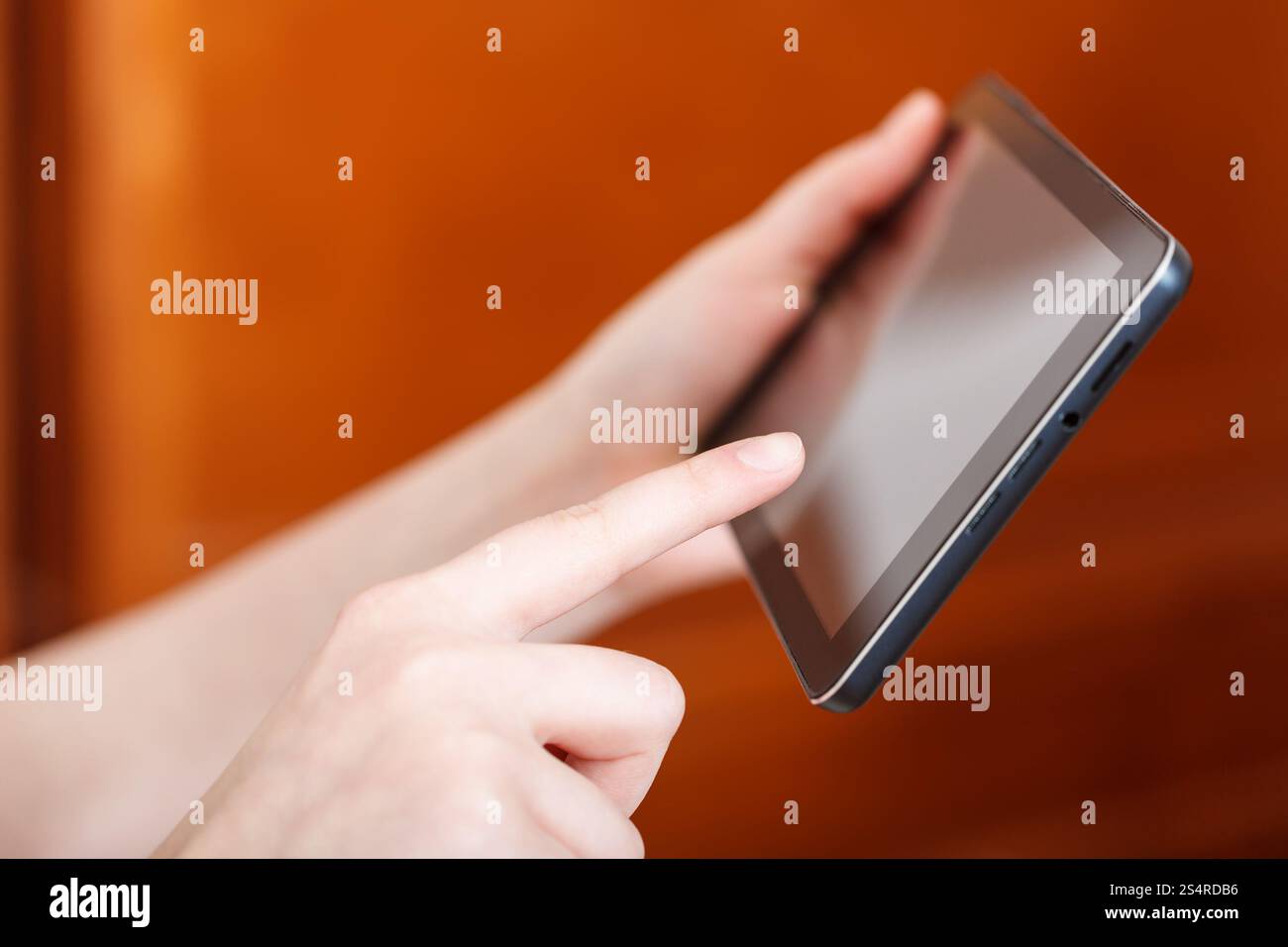Woman touching device screen hi-res stock photography and images - Alamy