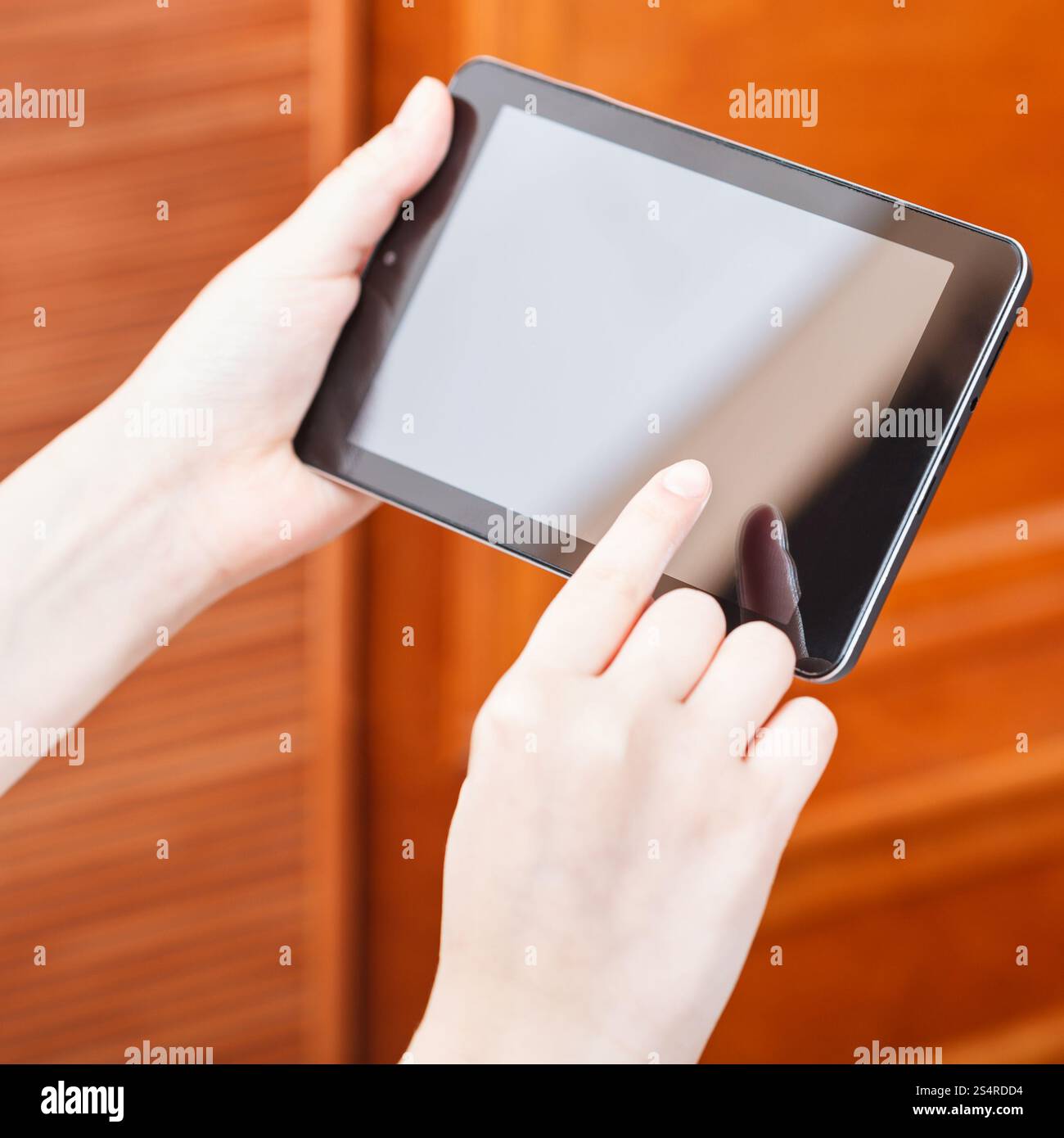 finger pressing tablet pc screen in office Stock Photo - Alamy