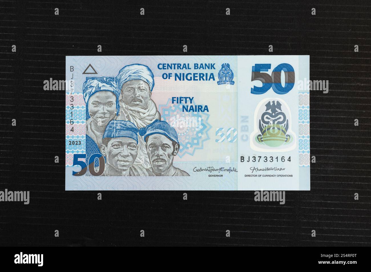 The Nigeria fifty naira banknote portrays four individuals adorned in ...