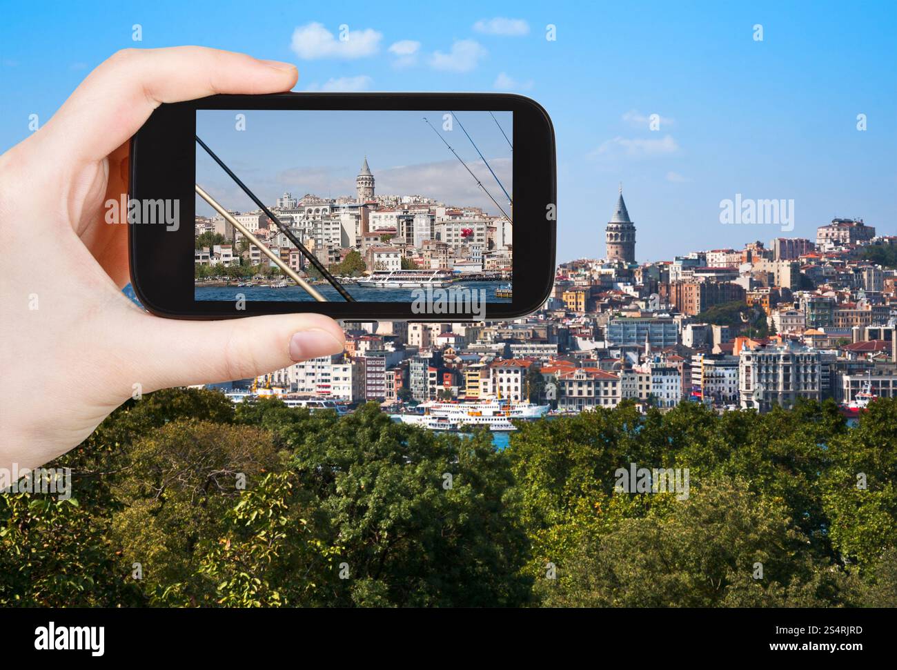 travel concept - tourist taking photo of Galata Tower in Istanbul on ...
