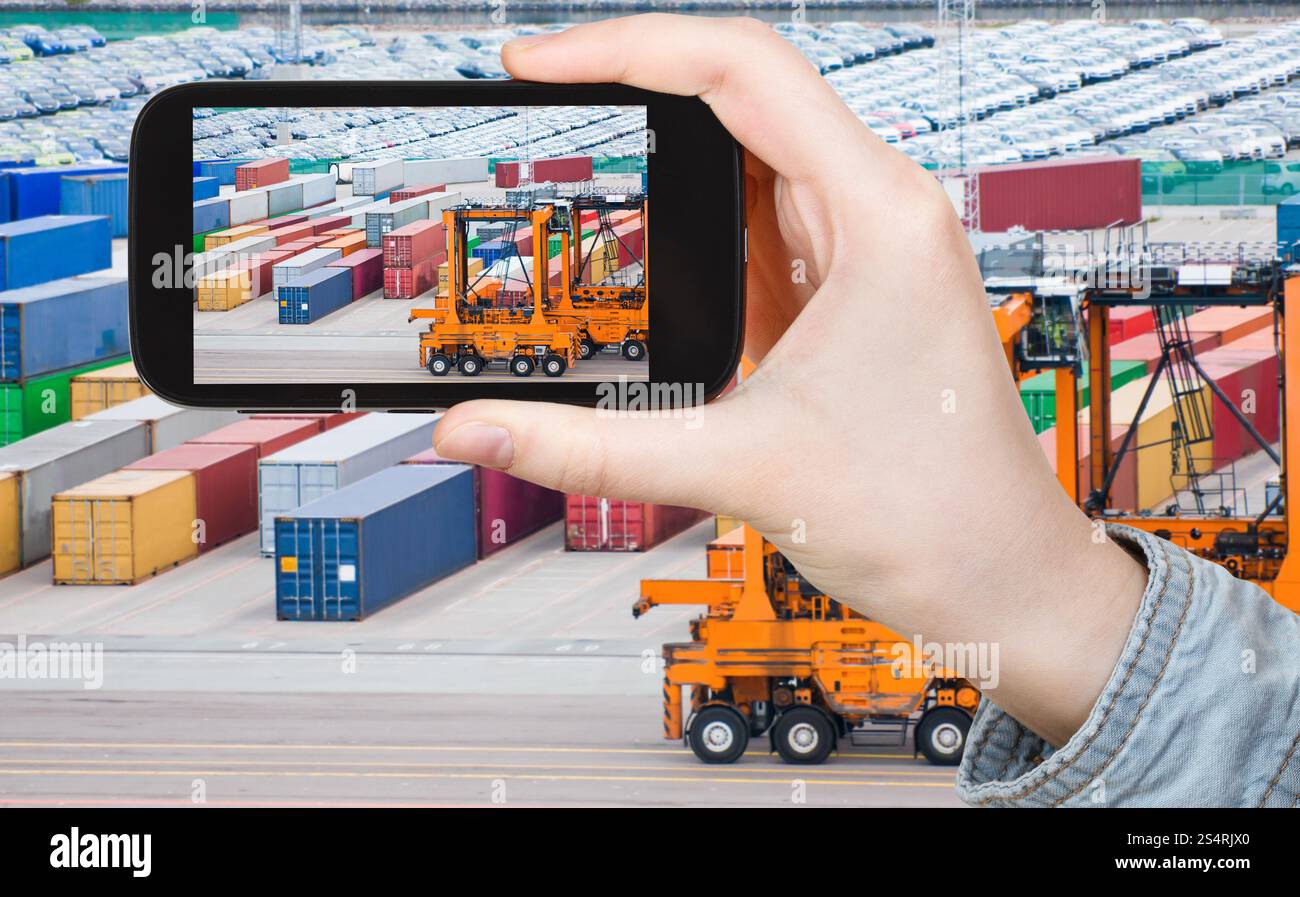 travel concept - tourist taking photo of freight containers in ...
