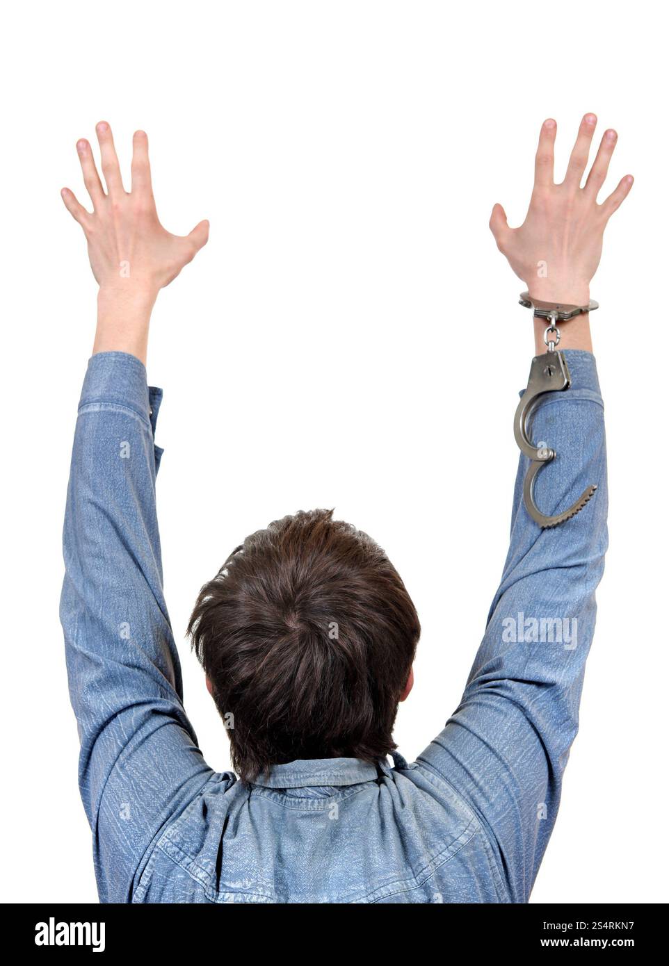 Rear View of the Man with Hands up and Unlocked Handcuffs Isolated on ...