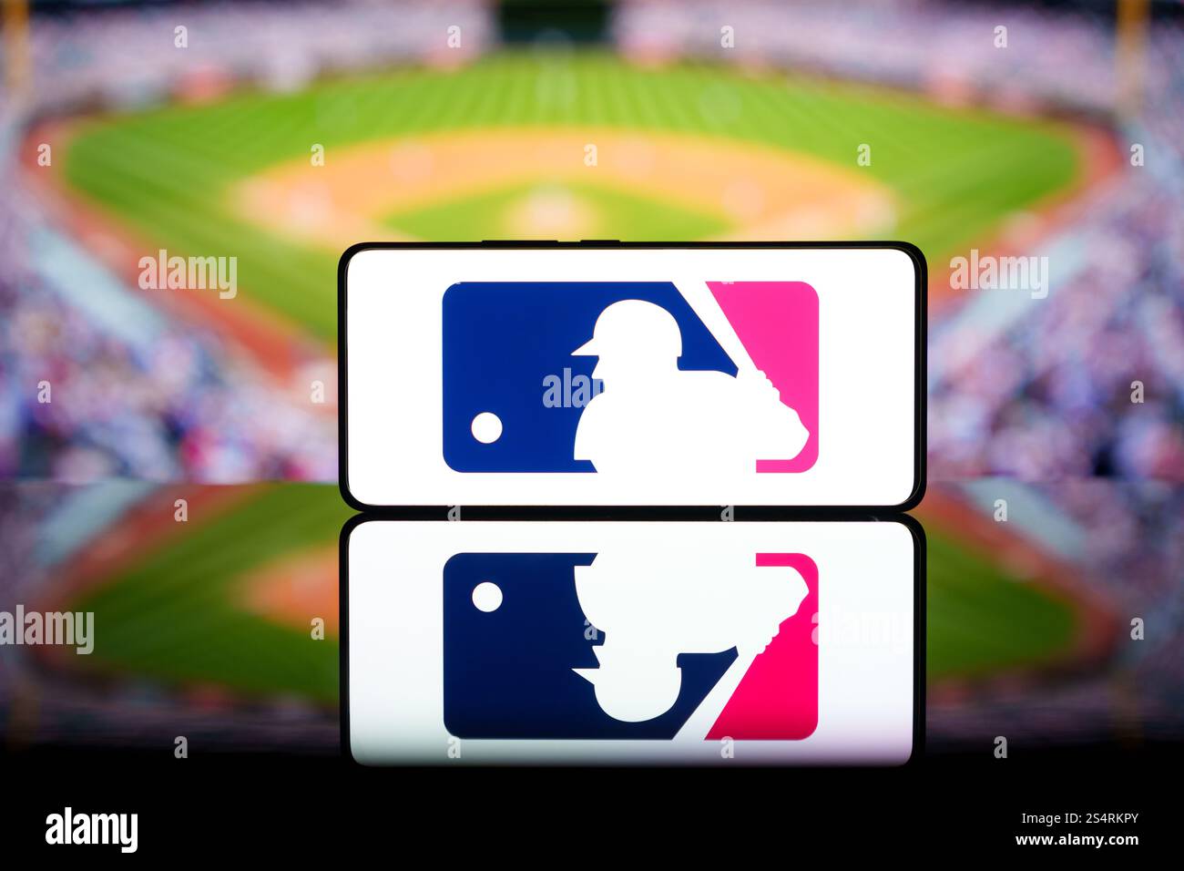 A smartphone displaying the Major League Baseball (MLB) logo with a ...