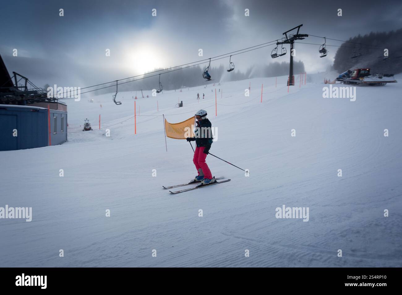 Young woman riding down the ski slope in Austrian ski resort Stock ...