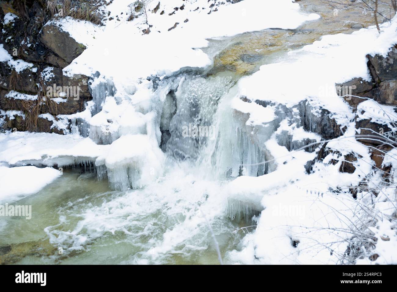 Fast mountain river covered ice hi-res stock photography and images - Alamy