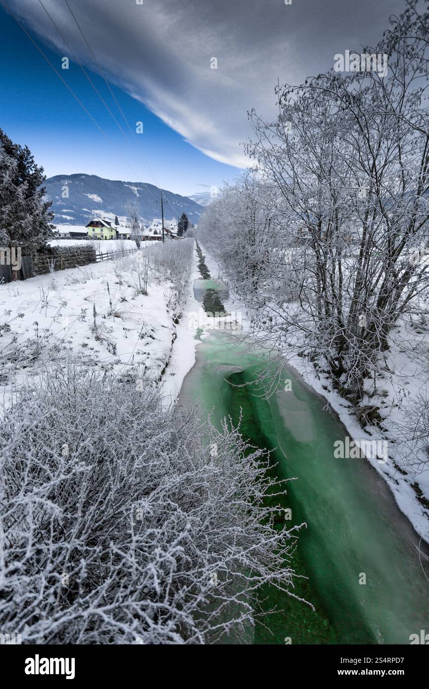 Big channel in winter at alpine valley covered by snow Stock Photo - Alamy