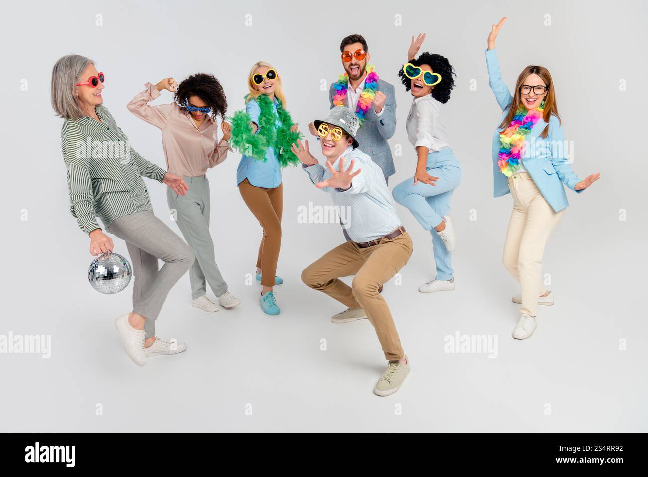 Group of diverse professionals celebrating together in a fun playful ...