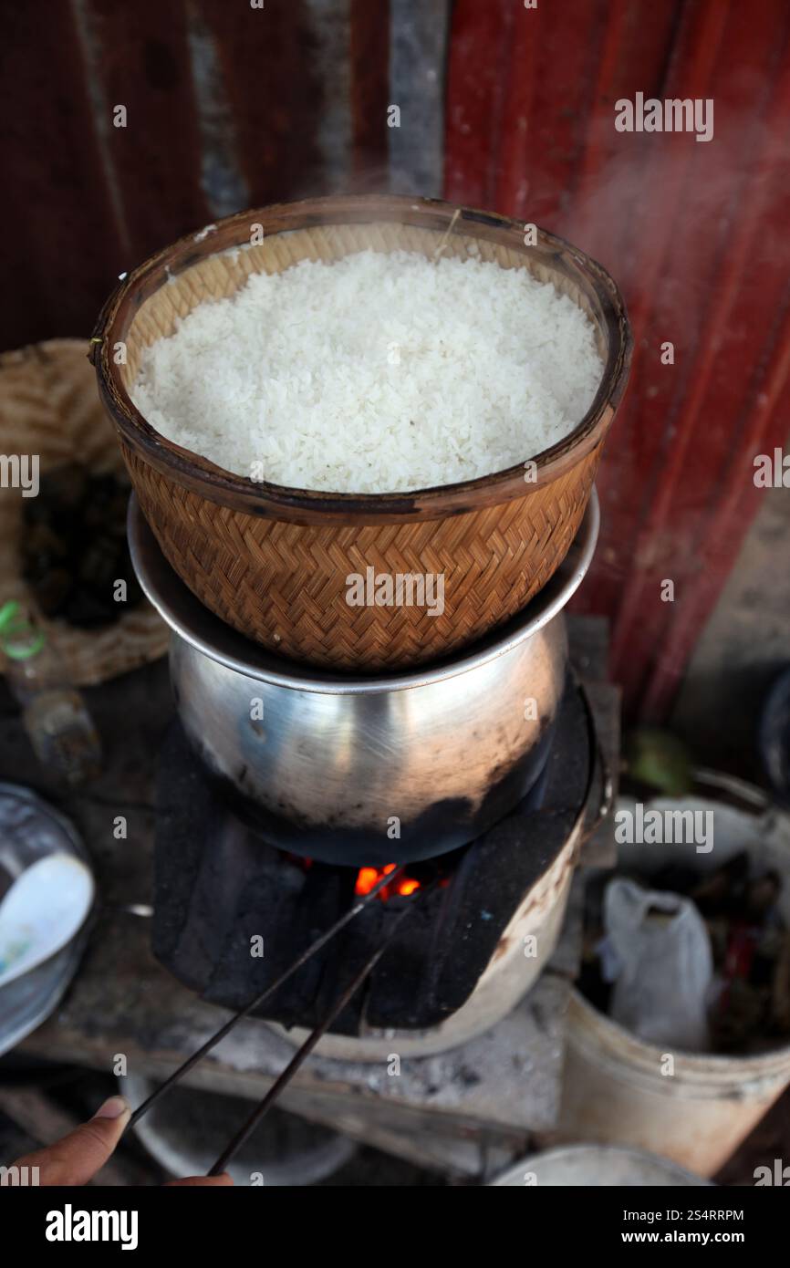 lao rice is cooking in a village near the city of Amnat Charoen in the ...