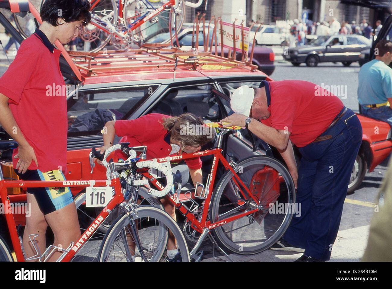 Support car during a cycling competition, Italy 1980s Stock Photo - Alamy