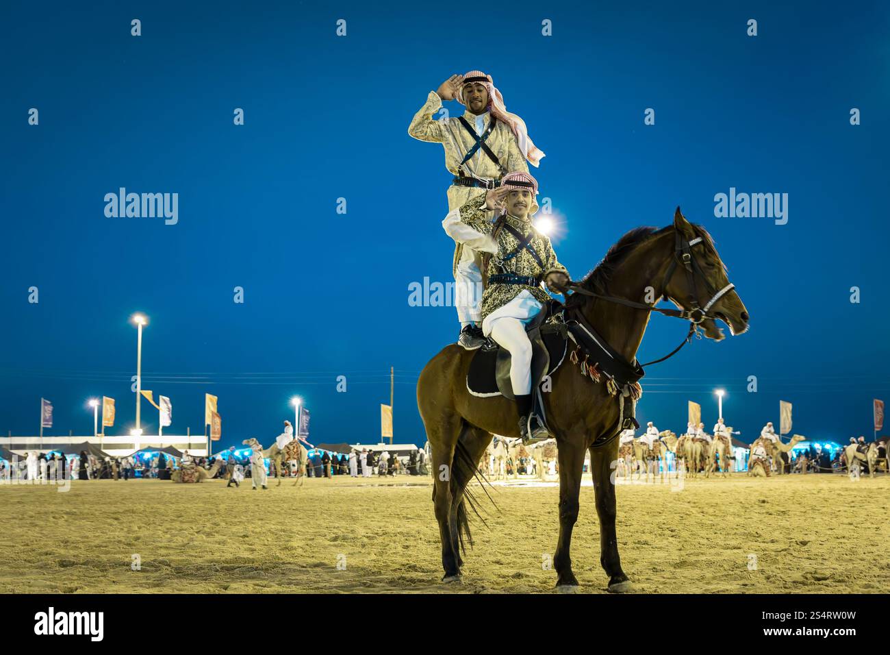 Saudi Arabian horse rider with his horse at a traditional Desert Safari ...