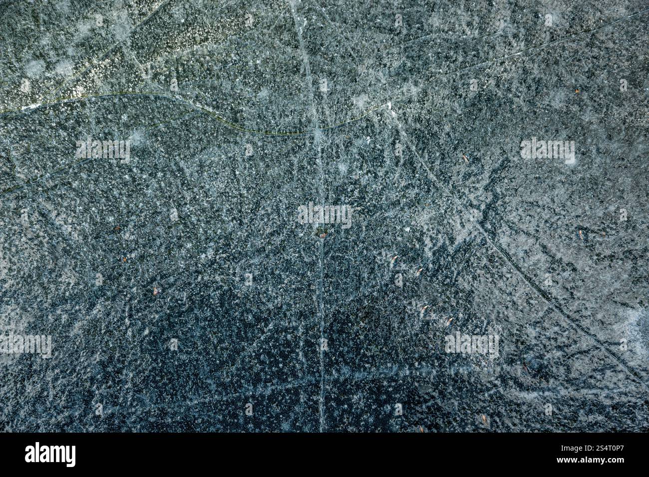 Closeup texture of cracked ice on lake Stock Photo - Alamy