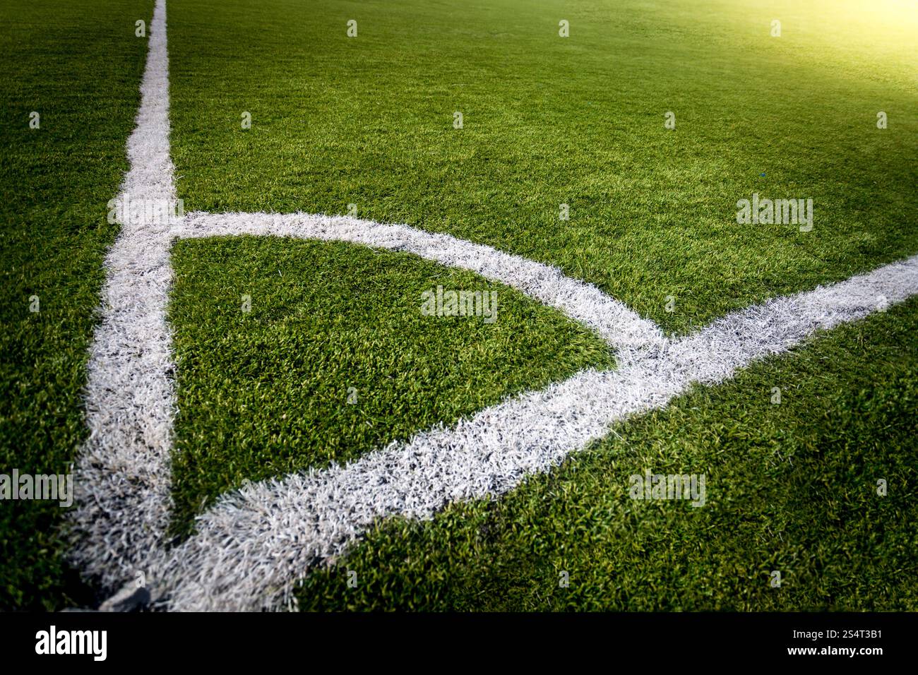 Photo of corner of soccer field lit by sun rays Stock Photo - Alamy
