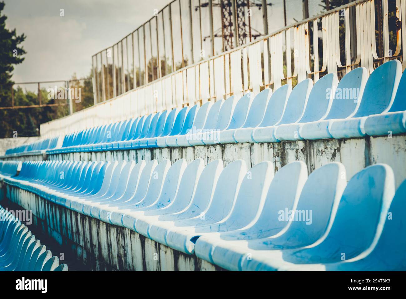 Toned photo of empty rows of seats on old stadium Stock Photo - Alamy