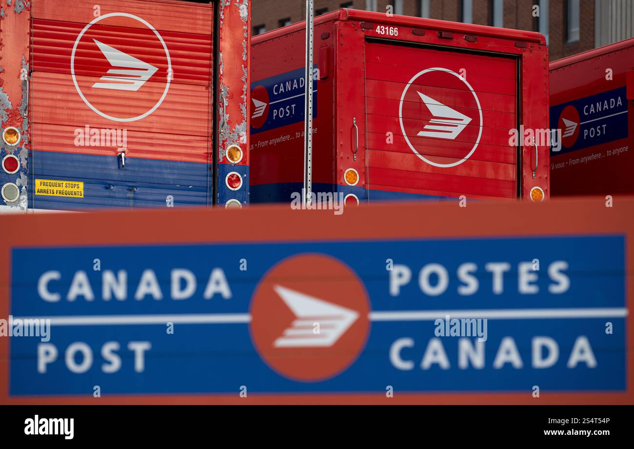 Ottawa, Canada. 18th Nov, 2024. Canada Post signage and parked vehicles ...