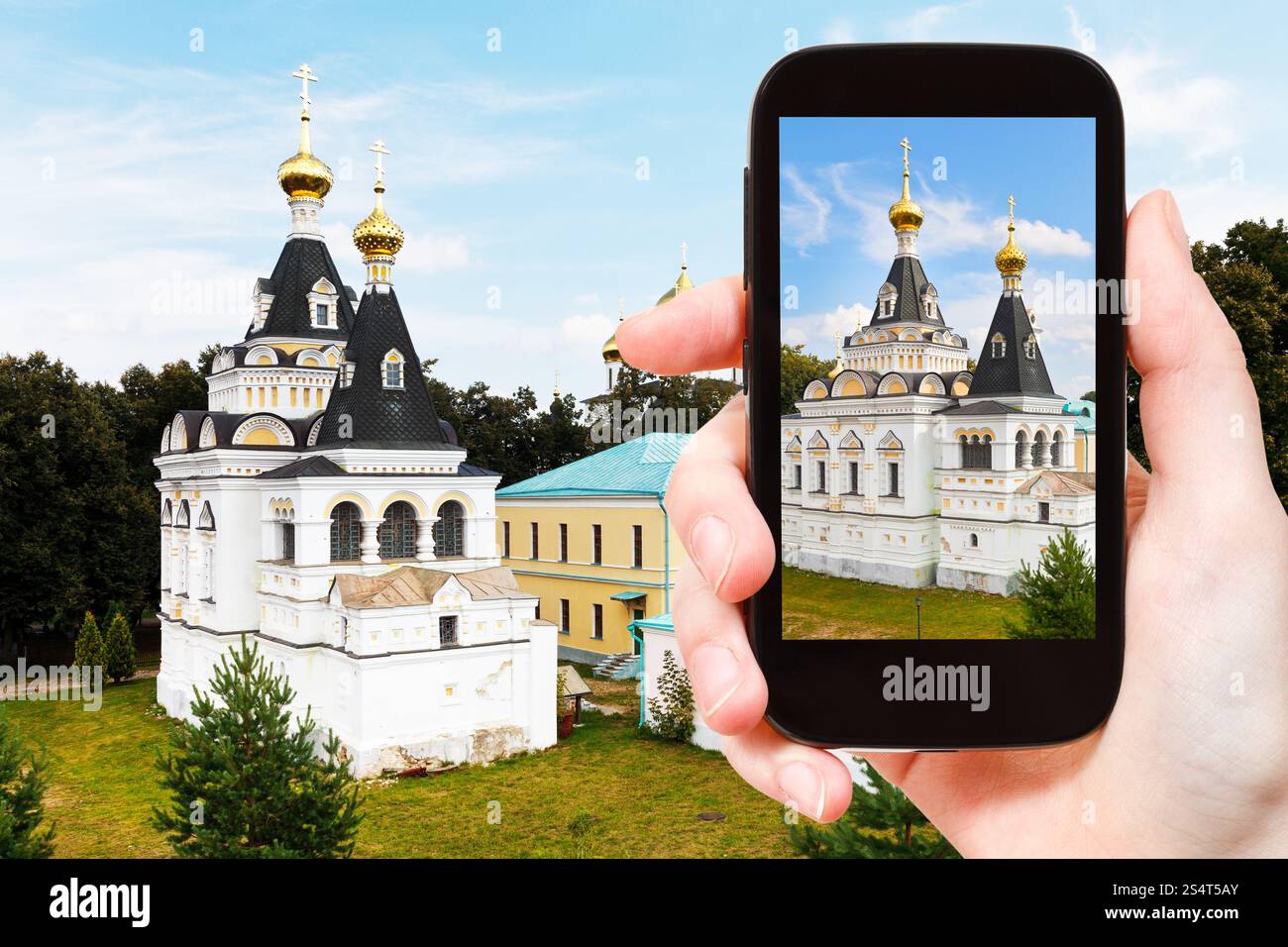 travel concept - tourist takes picture of Elizabeth church in Dmitrov ...