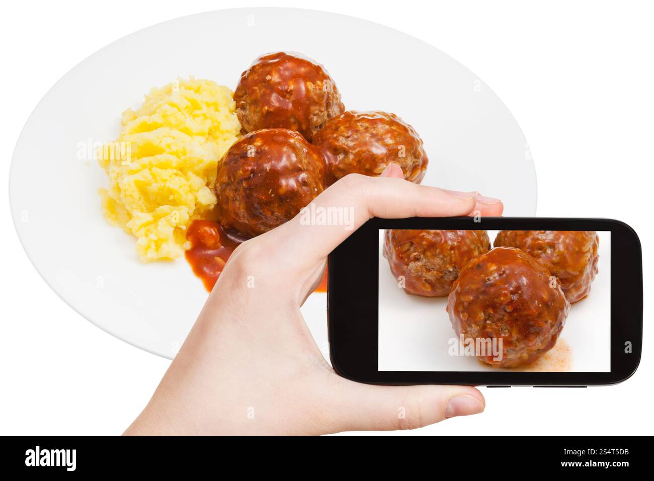 photographing food concept - tourist takes picture of roasted meatballs ...