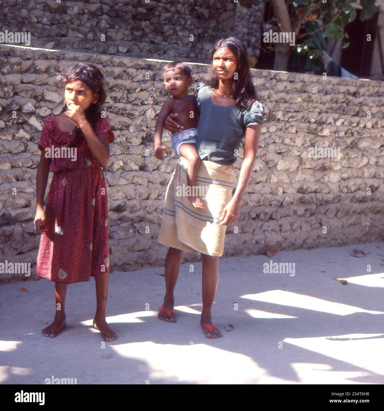 Native children and woman, Maldives 1990s Stock Photo - Alamy