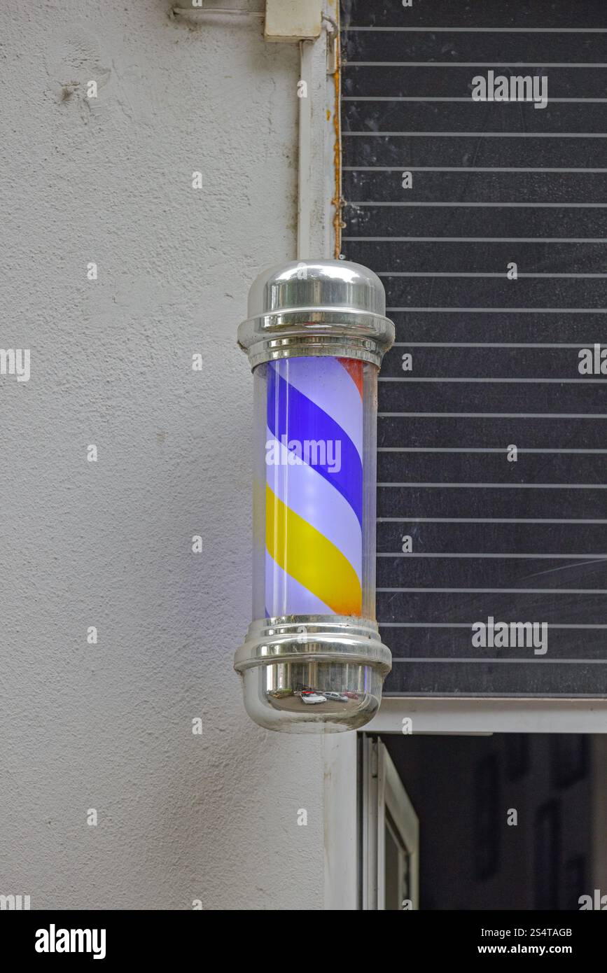 Turning Swirl Lamp in Front of Barber Shop Pole Symbol With Arrow Stock ...