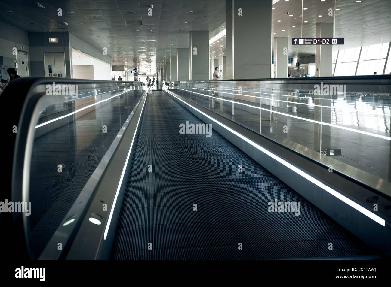 Photo of long horizontal escalator at international airport terminal ...