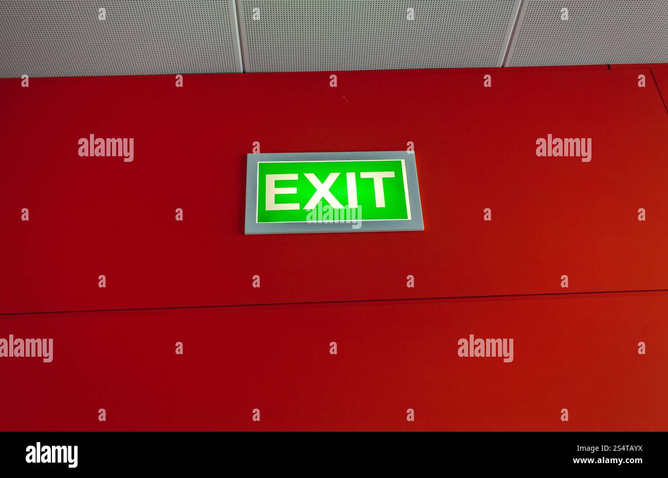 Sign on green wall hi-res stock photography and images - Alamy