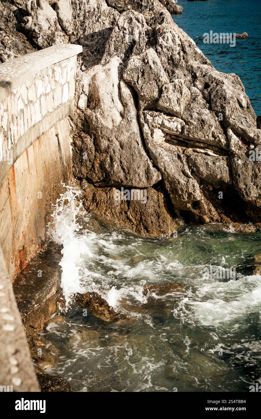 Beautiful landscape of sea waves breaking on high cliffs Stock Photo ...